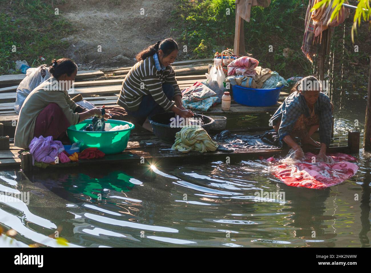 Inlay Lake, Shan State, Myanmar. Women washing laundry in the lake ...