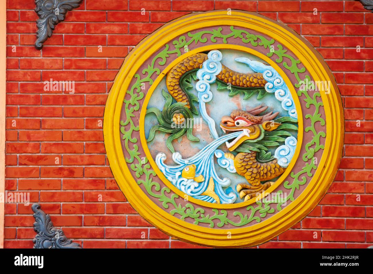 Vietnam, Hoi An. Colorful dragon relief on side of building Stock Photo ...