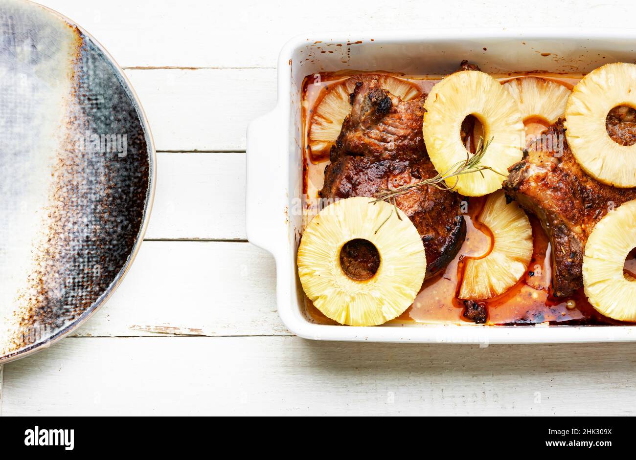 Appetizing beef meat baked with pineapple rings. Beef entrecote in ...