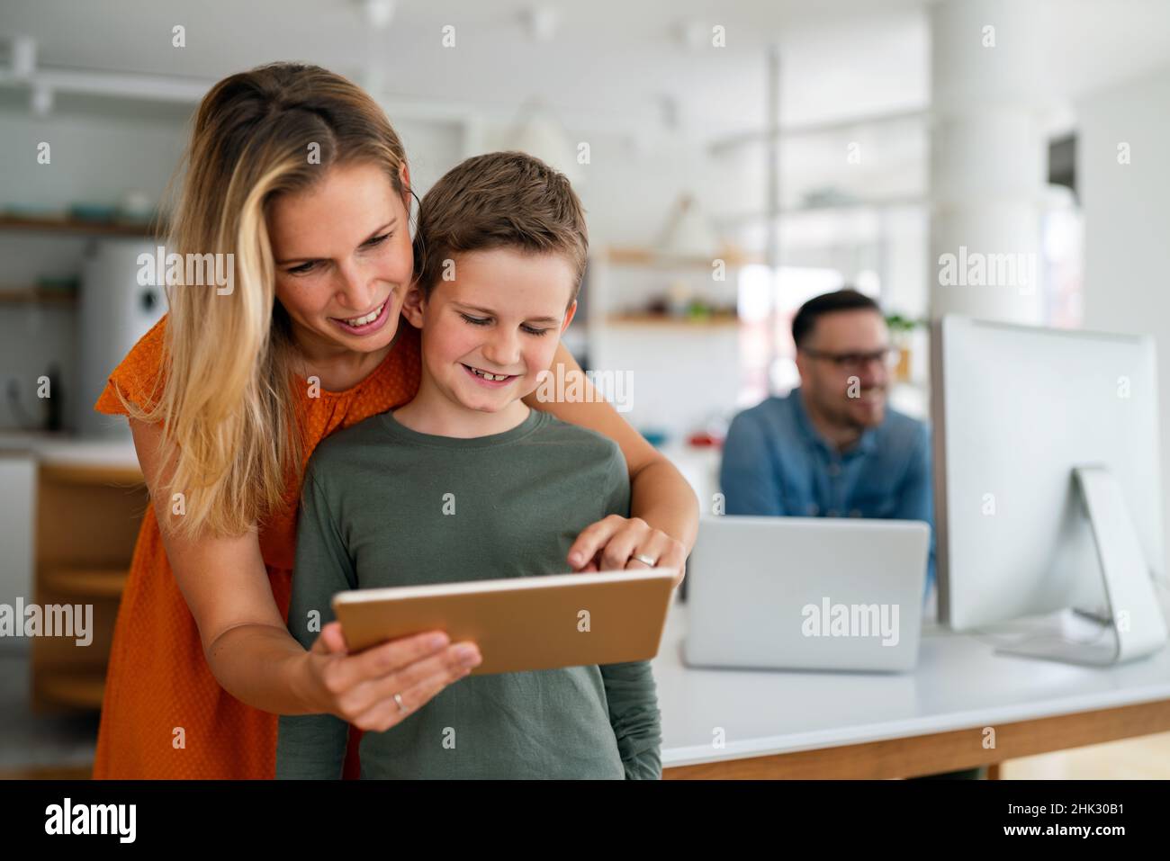 Distance learning, online education, home work concept. Family with ...