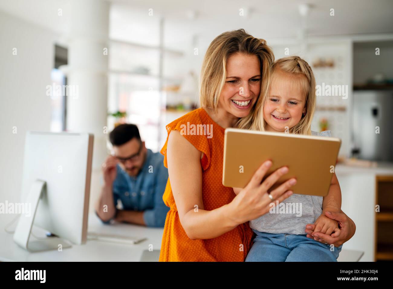 Device technology family online education concept. Happy family with ...