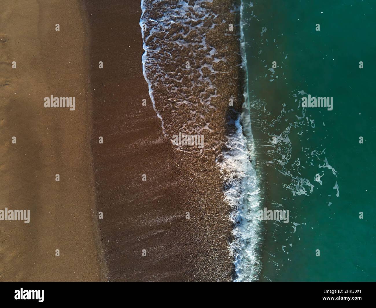 Aerial view of sandy beach and sea with waves, Top view, amazing nature ...