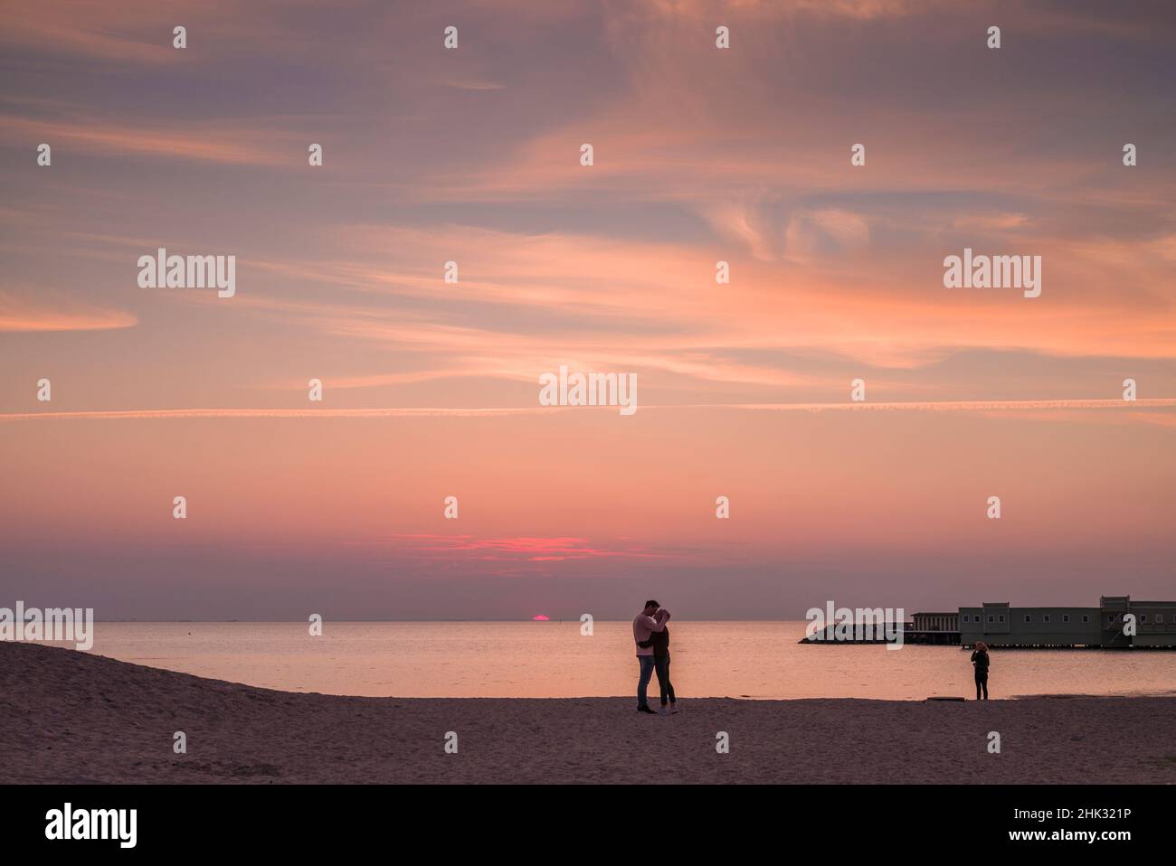 Sweden, Scania, Malmo, Riberborgs Stranden beach area, couple kissing ...