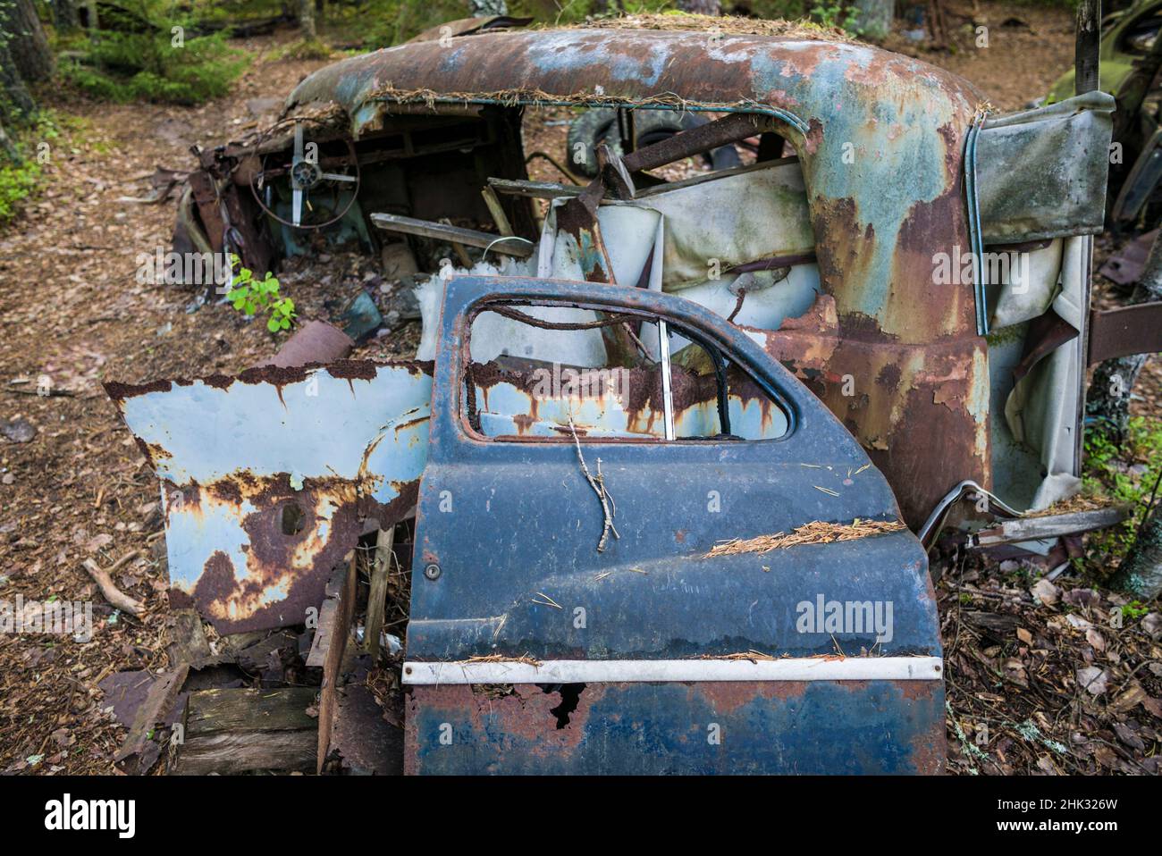 Sweden, Smaland, Ryd, Kyrko Mosse Car Cemetery, former junkyard now pubic park, junked cars ...