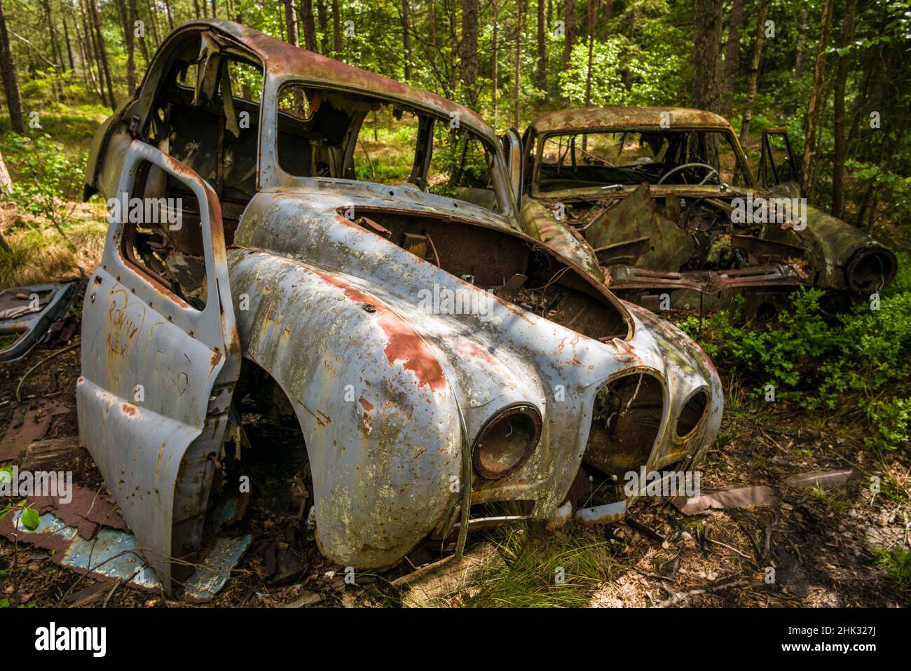 Sweden, Smaland, Ryd, Kyrko Mosse Car Cemetery, former junkyard now pubic park, junked cars ...