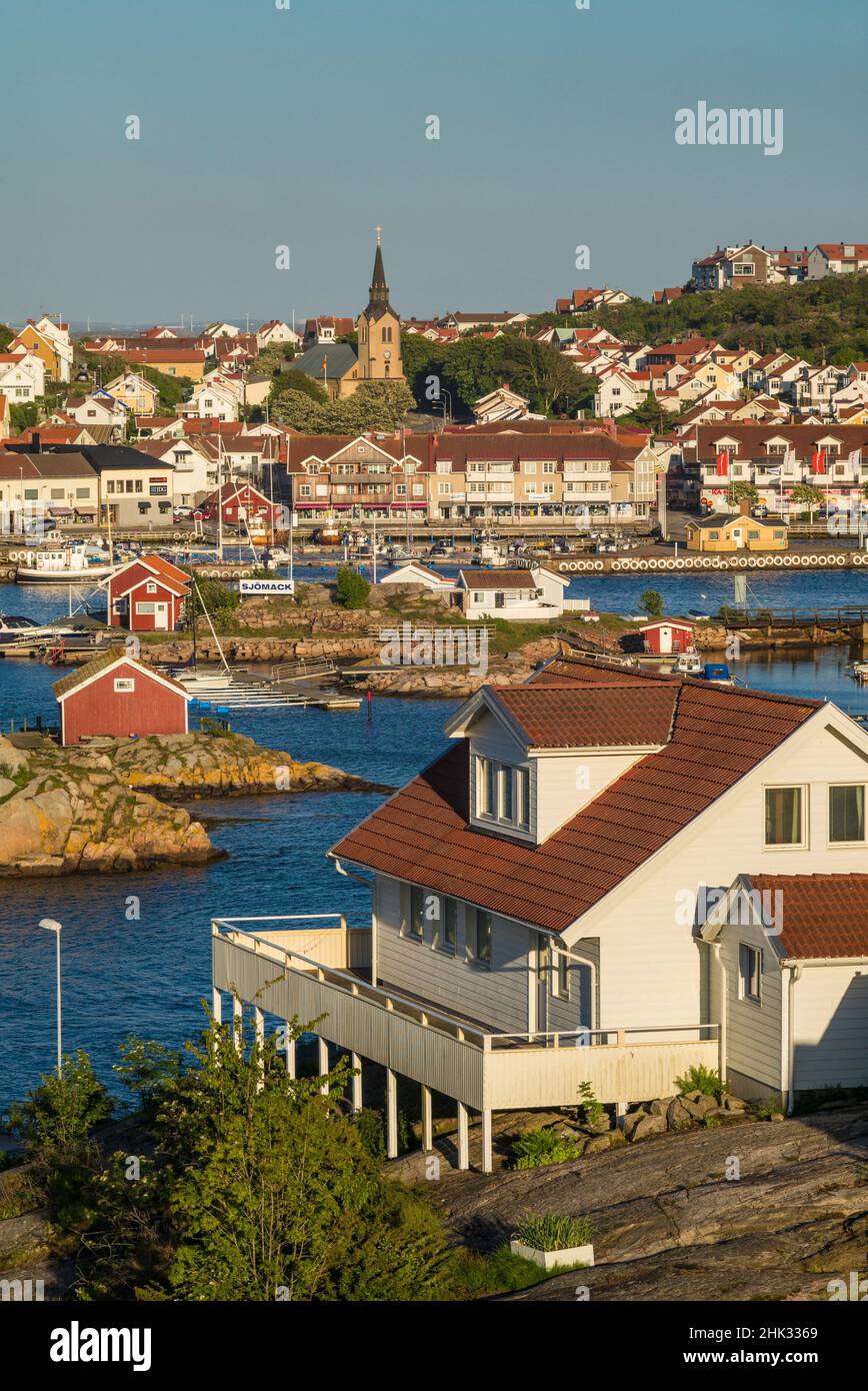 Sweden, Bohuslan, Kungshamn, high angle view of town and harbor, sunset ...
