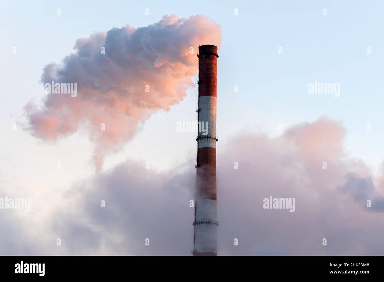 Smoke stack with smoke emission. Plant pipes pollute atmosphere ...