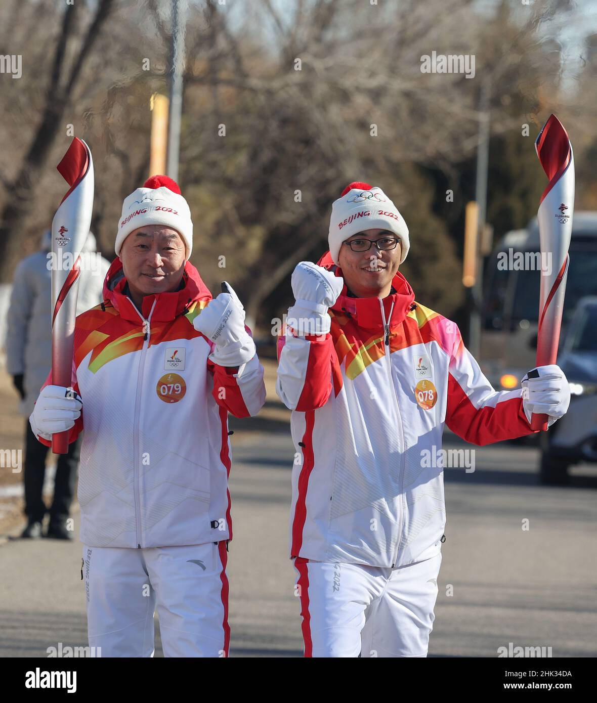 Beijing, China. 2nd Feb, 2022. Torch bearers Rong Yanming (R) and Li Xinmin attend the Beijing ...