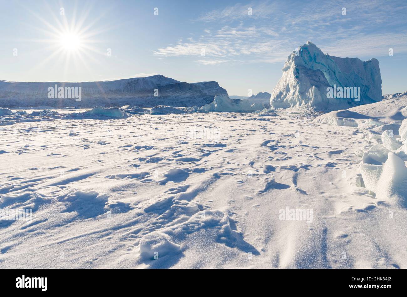 Icebergs frozen into the sea ice of the Uummannaq fjord system during ...