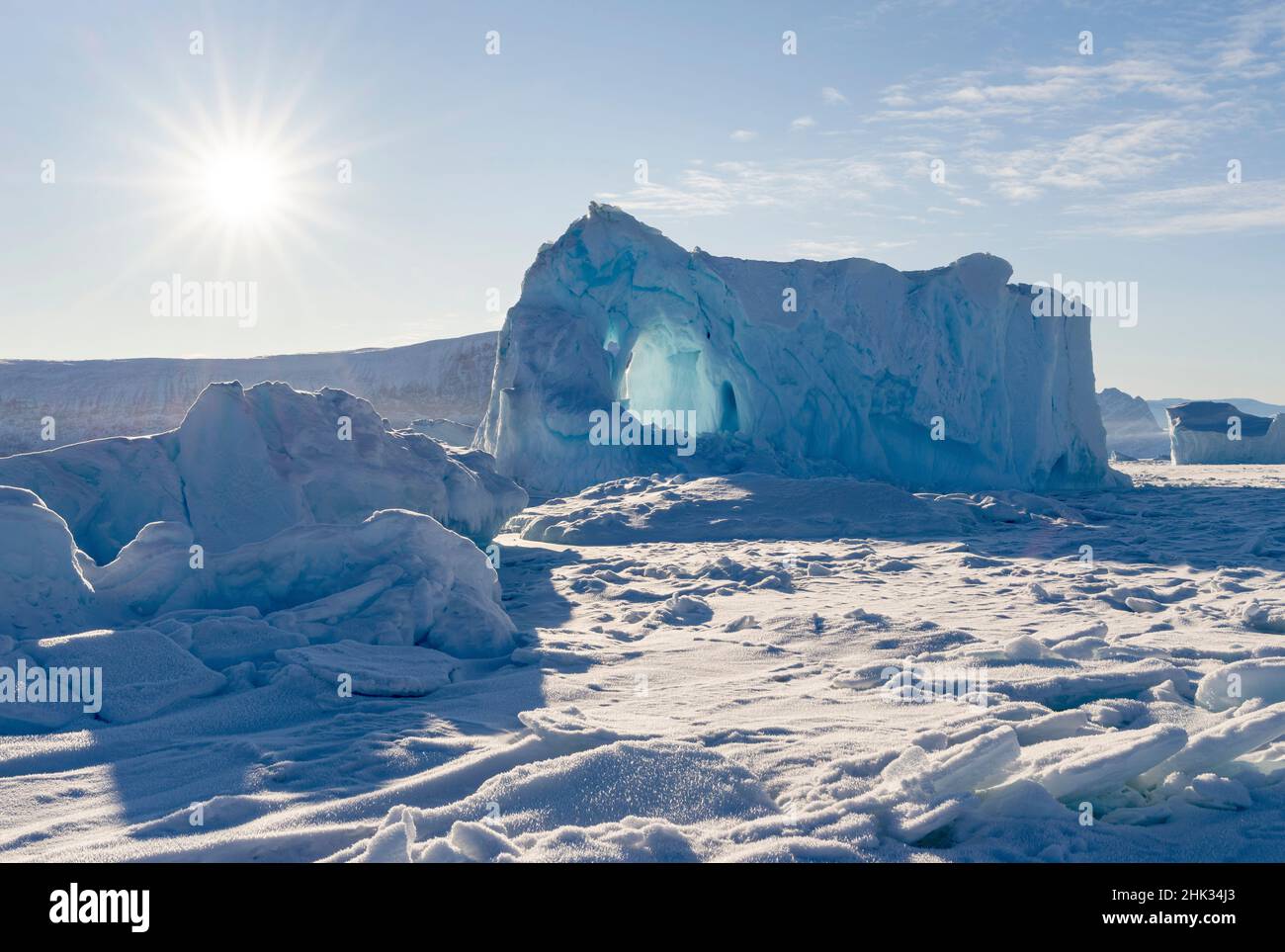 Icebergs frozen into the sea ice of the Uummannaq fjord system during ...