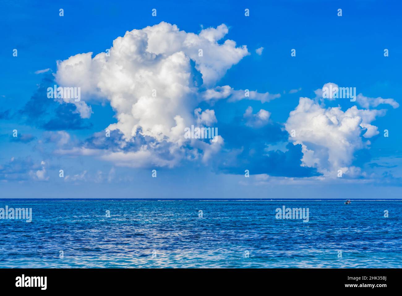 Colorful rain cloud, Moorea, Tahiti, French Polynesia. Different blue ...