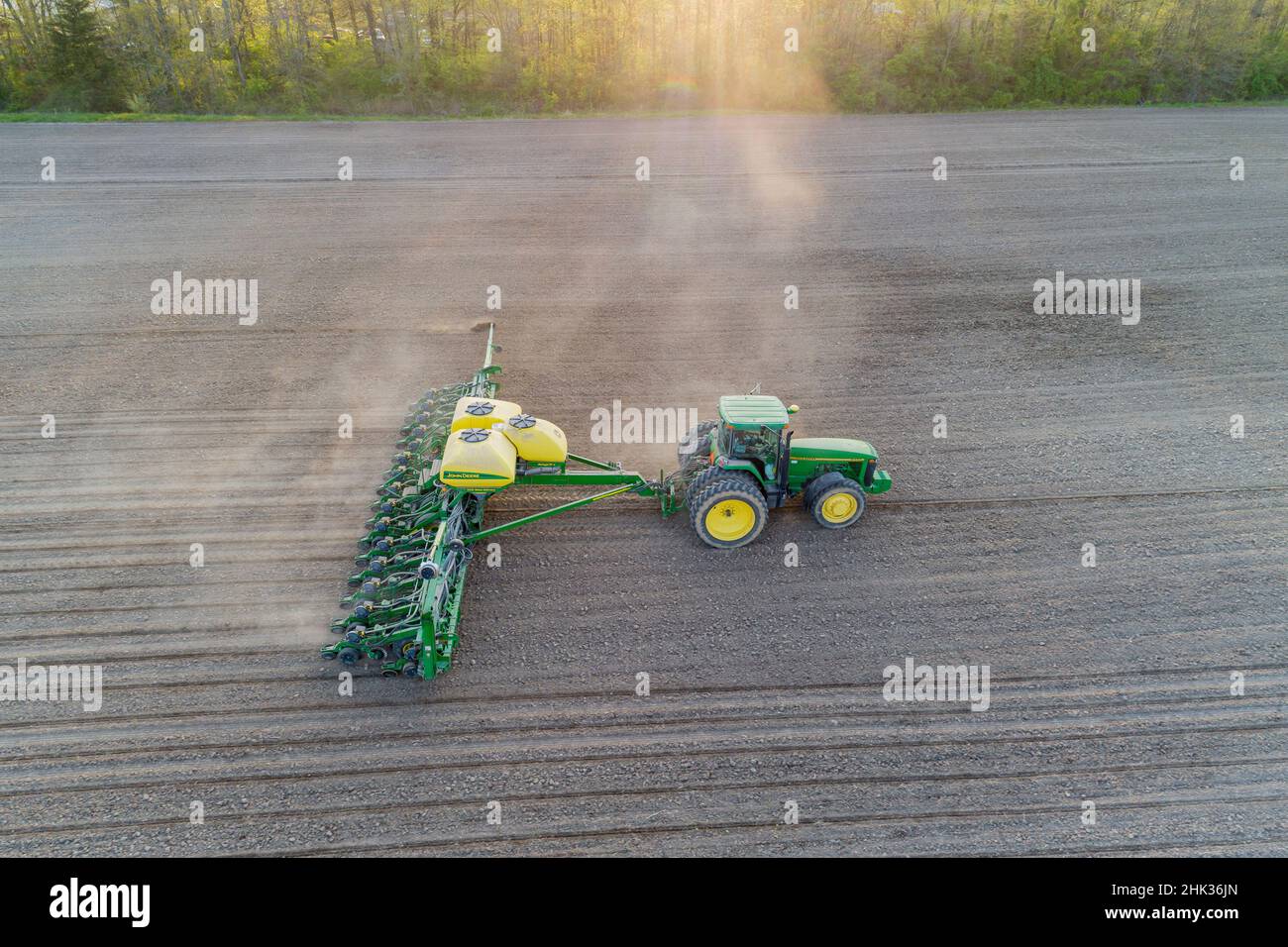 Aerial view of tractor planting corn field, Marion County, Illinois ...