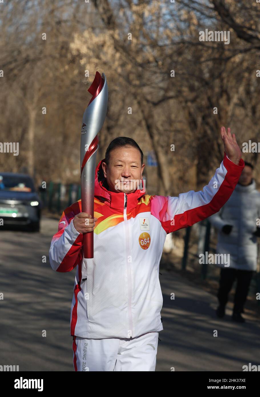 Beijing, China. 2nd Feb, 2022. Torch bearer Bu Pengzhou runs with the ...