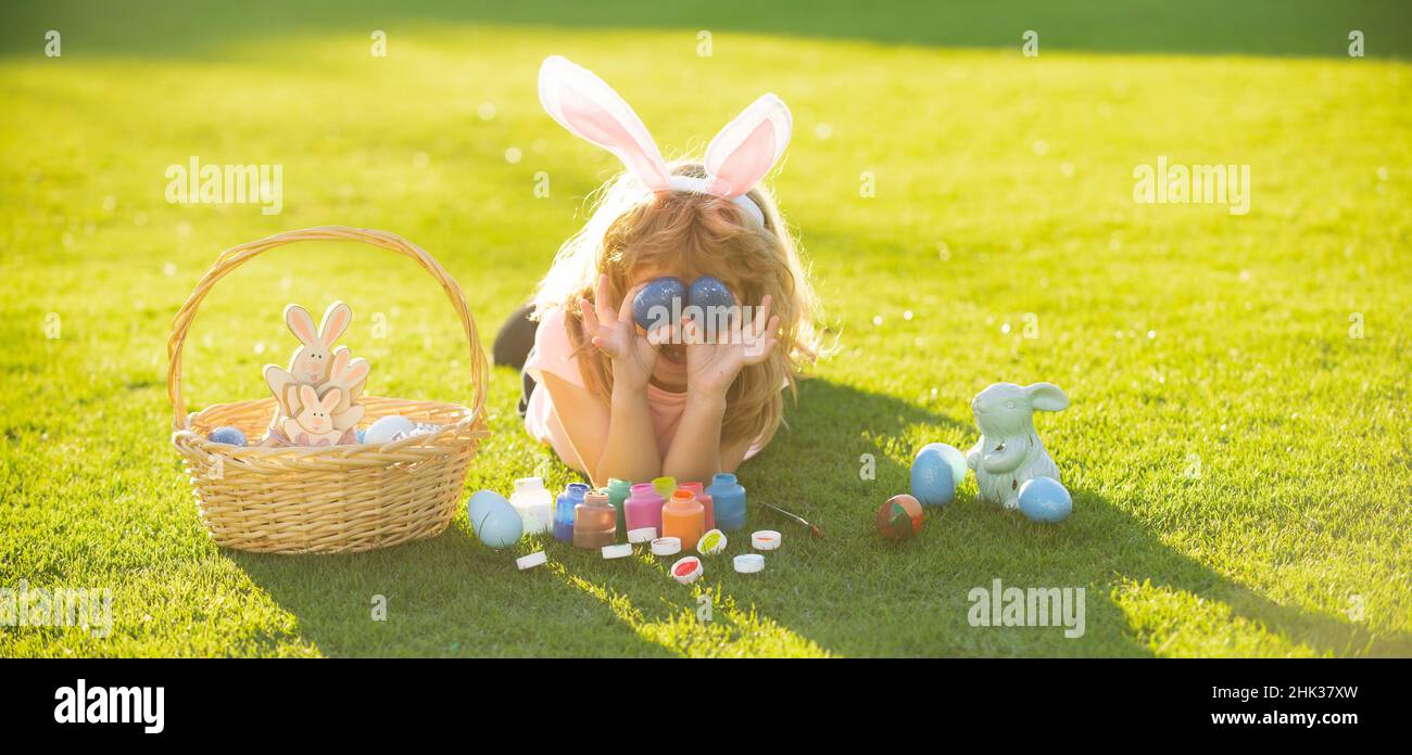 Easter bunny kids. Child boy in bunny Easter cover eyes with eggs Stock ...