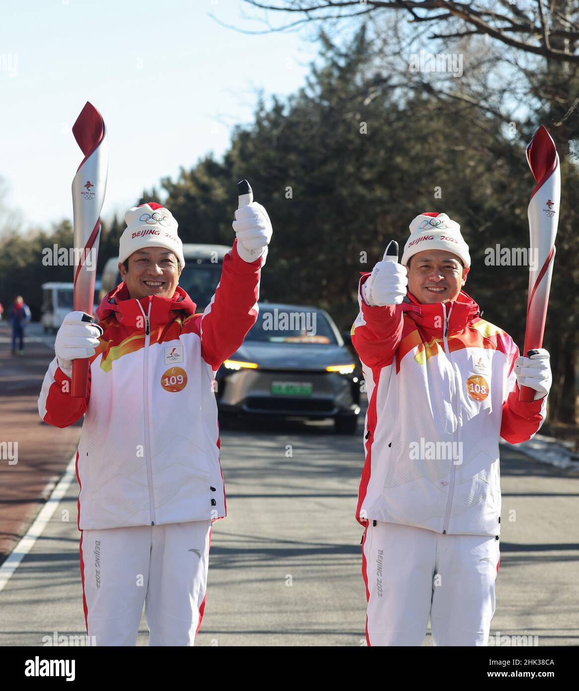 Beijing, China. 2nd Feb, 2022. Torch bearers Awang Lobsangdondrup (L ...