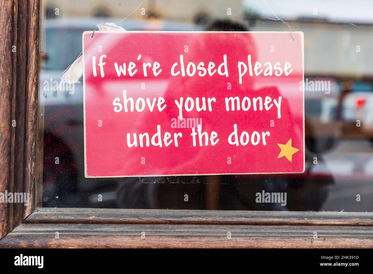 Fredericksburg, Texas, USA. Humorous sign in a storefront window in the ...