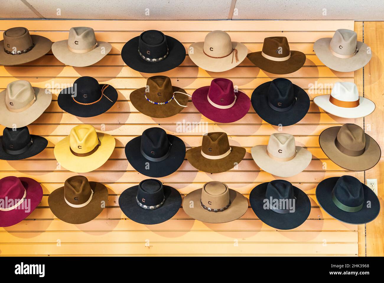 Bandera, Texas, USA. Cowboy hats displayed on the wall of a shop in ...
