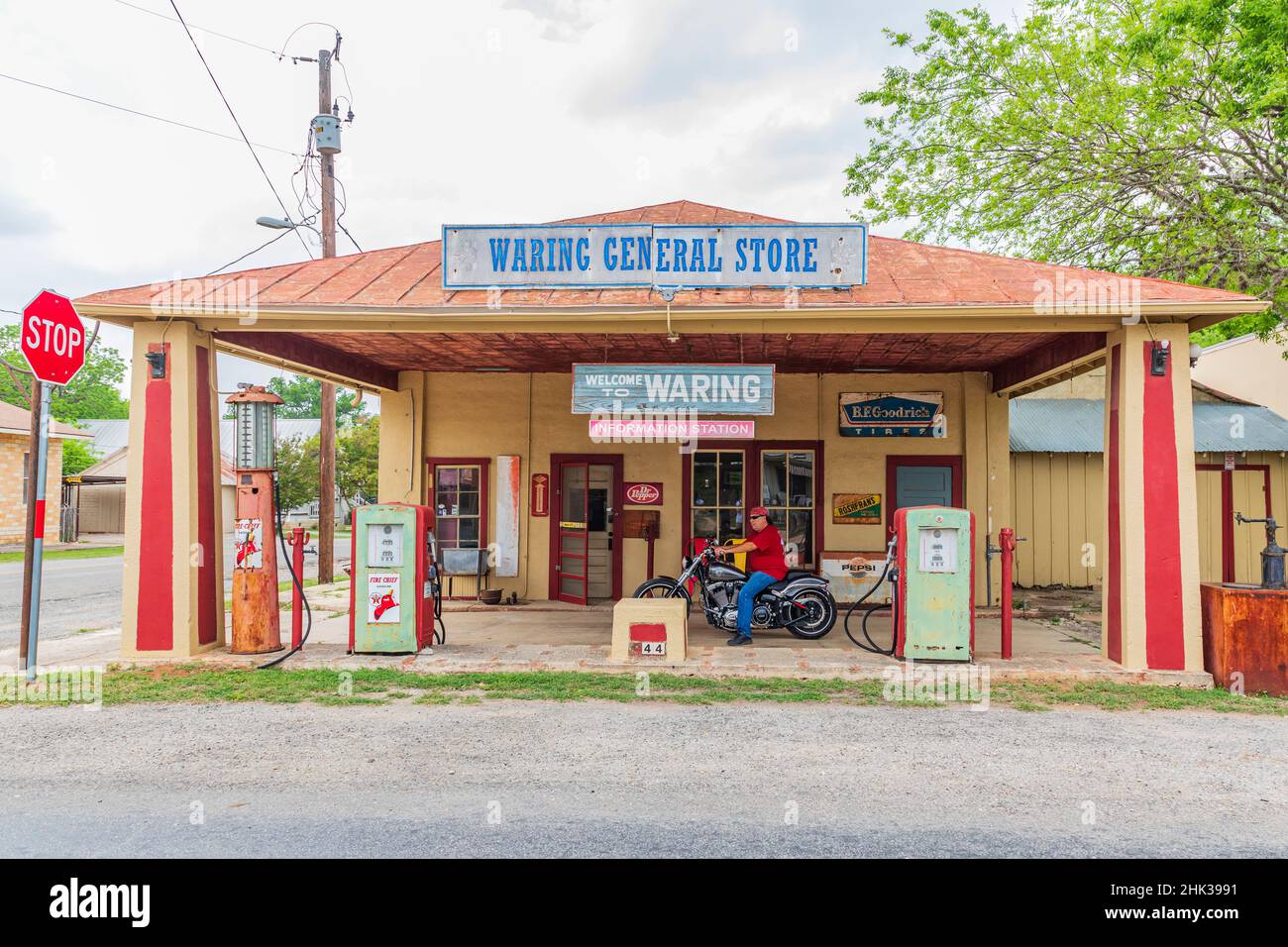 Waring, Texas, USA. Motorcyclist at a gas station in the Texas Hill ...