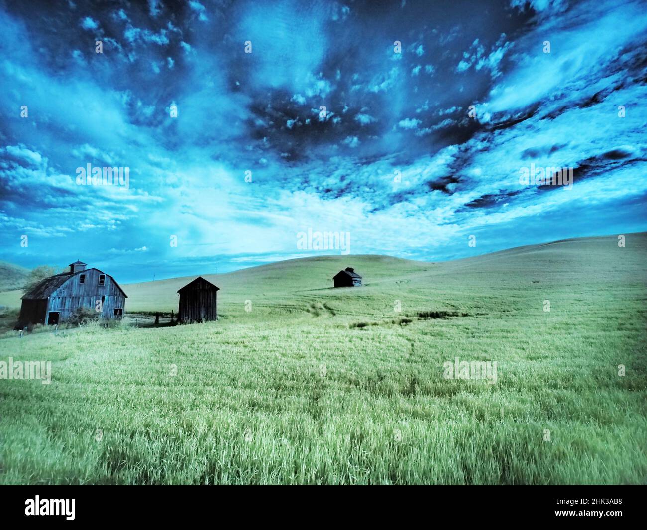 USA, Washington State, Palouse. Barn and out buildings with thunder ...
