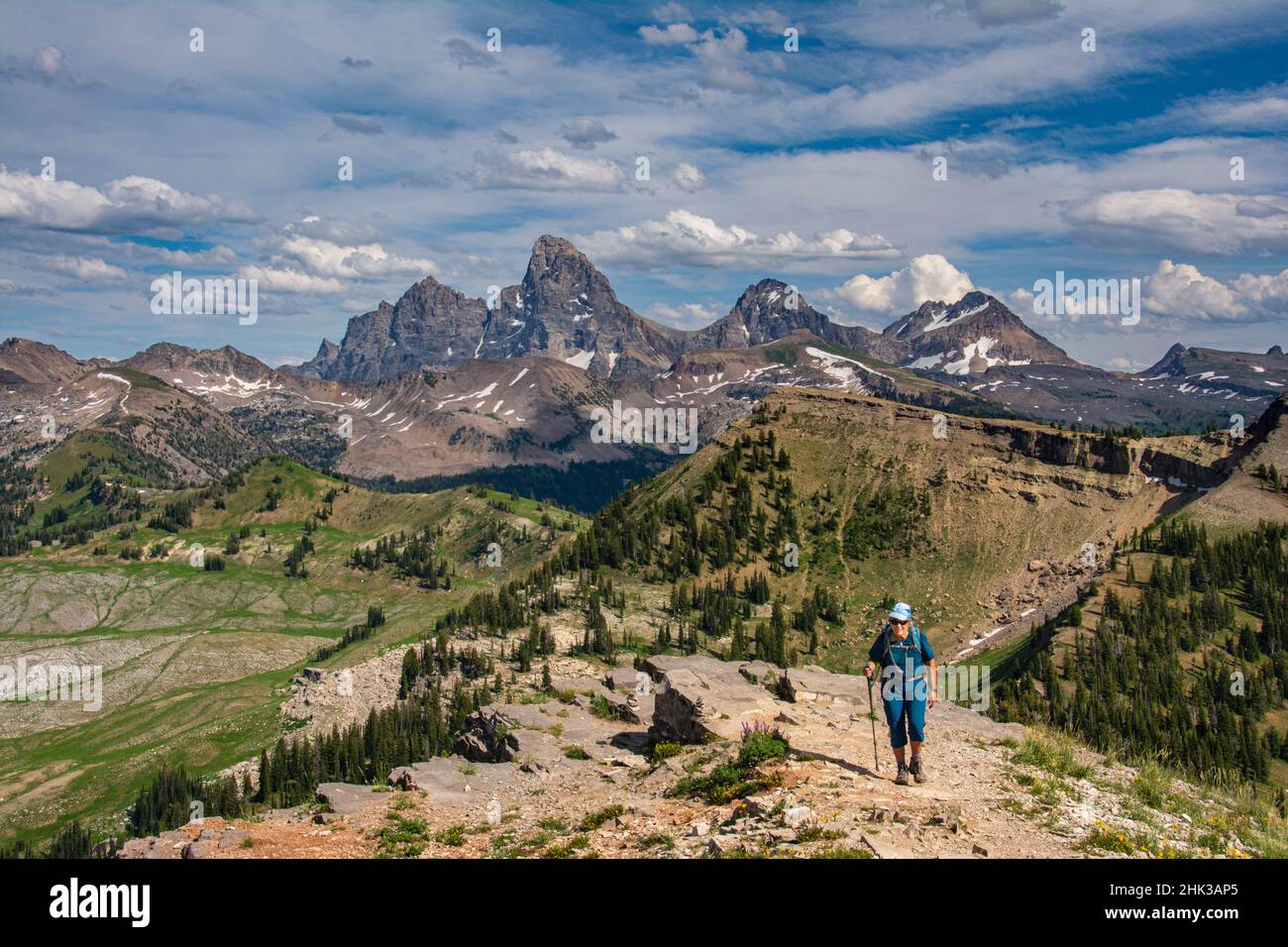 USA, Wyoming. Woman hiking in wilderness west side of Teton Mountains ...