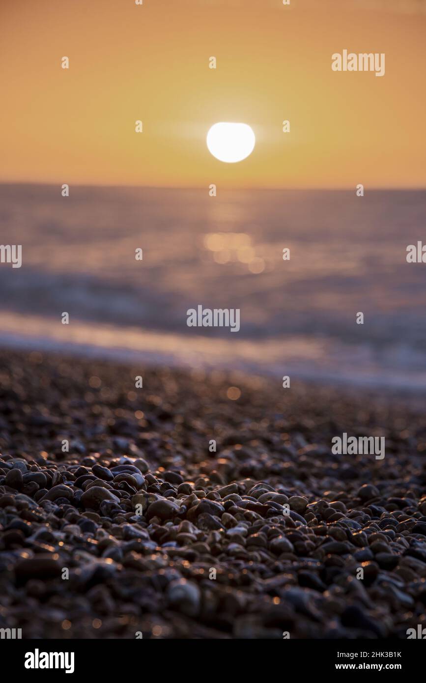 Vertical shot of an ocean at scenic sunset Stock Photo - Alamy