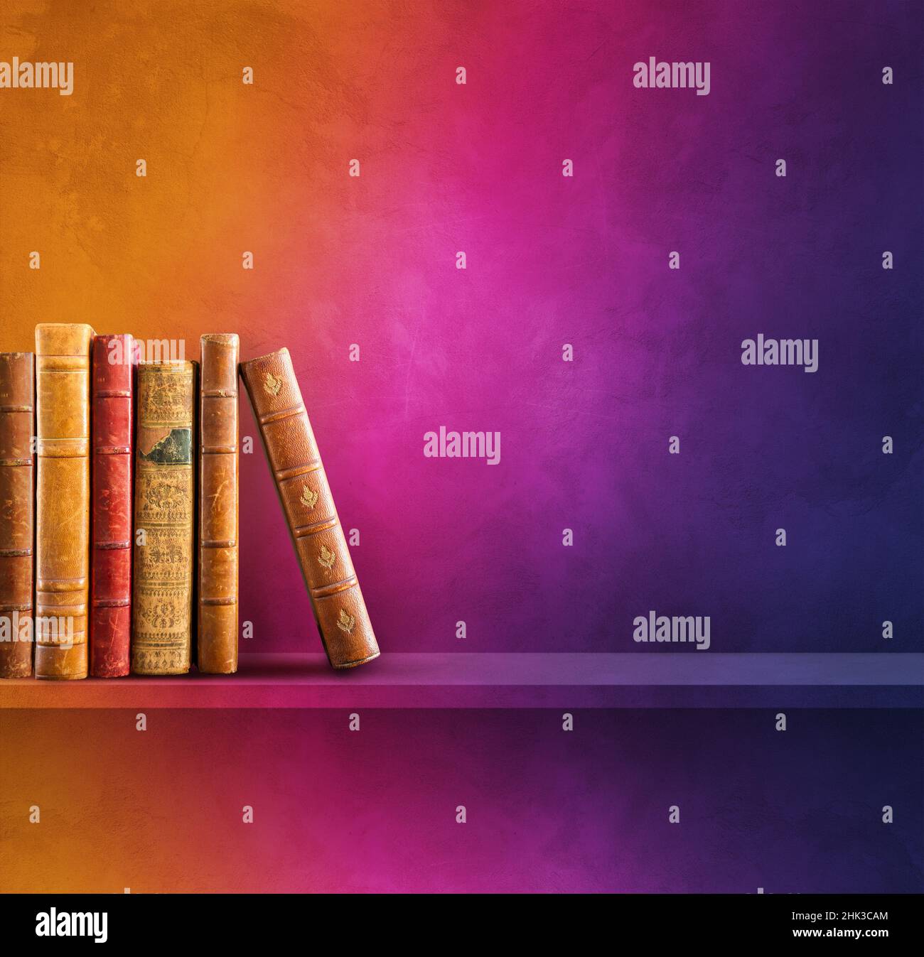 Row of old books on rainbow shelf. Square scene background Stock Photo - Alamy