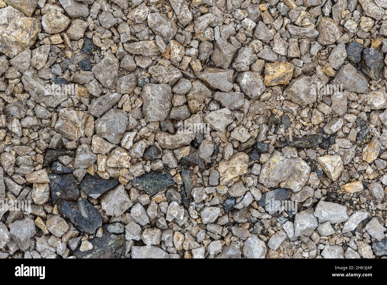 Gray pattern cobblestone forms background Stock Photo - Alamy
