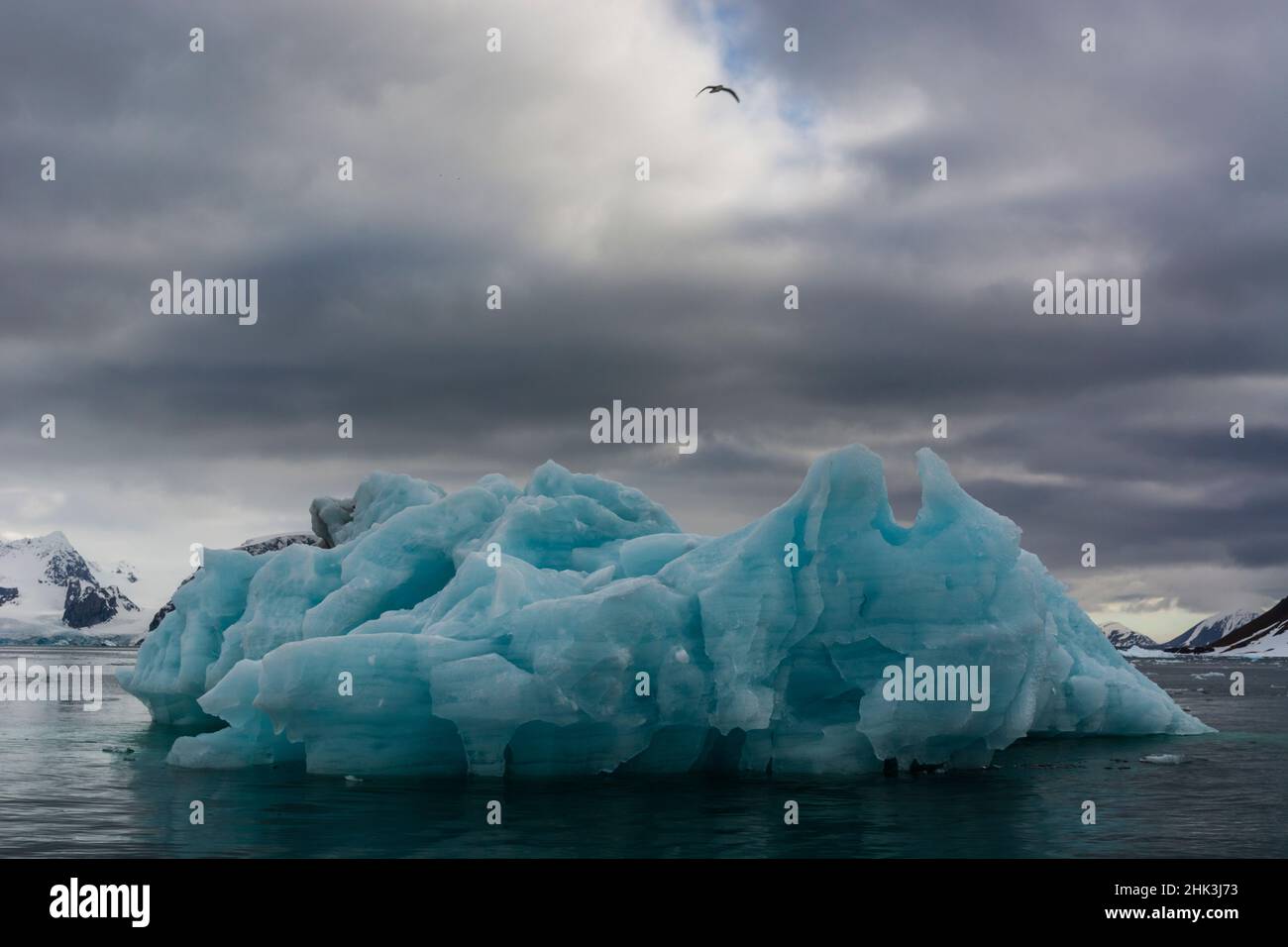 Iceberg under a stormy sky Stock Photo - Alamy
