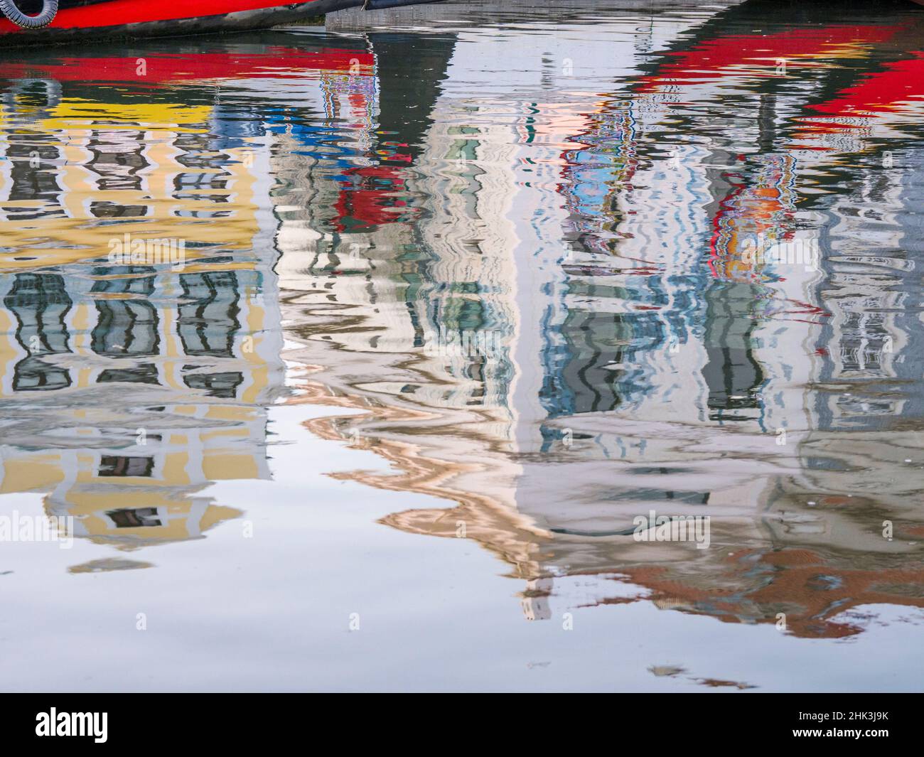 Portugal, Aveiro. Reflections of traditional and colorful salt boats ...