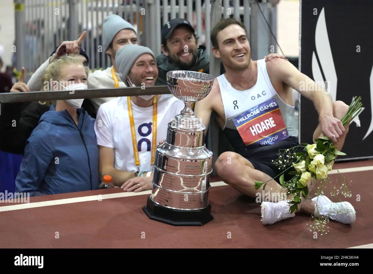 Oliver Hoare (AUS) poses with trophy after winning the Wanamaker Mile ...