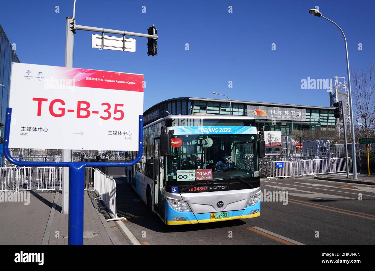 An Olympic transport bus in the closed loop system makes its way passed ...