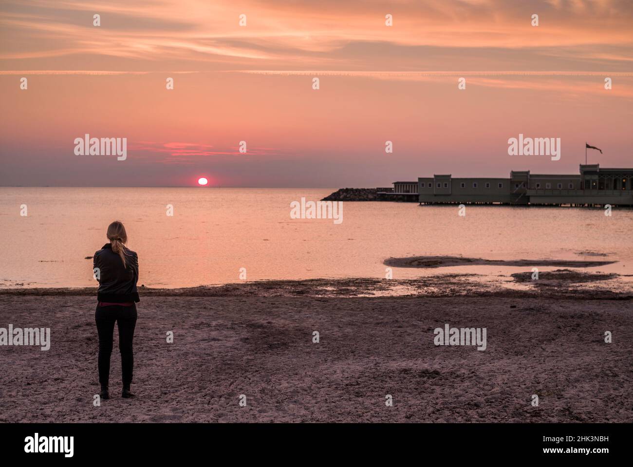 Sweden, Scania, Malmo, Riberborgs Stranden beach area, woman watching ...