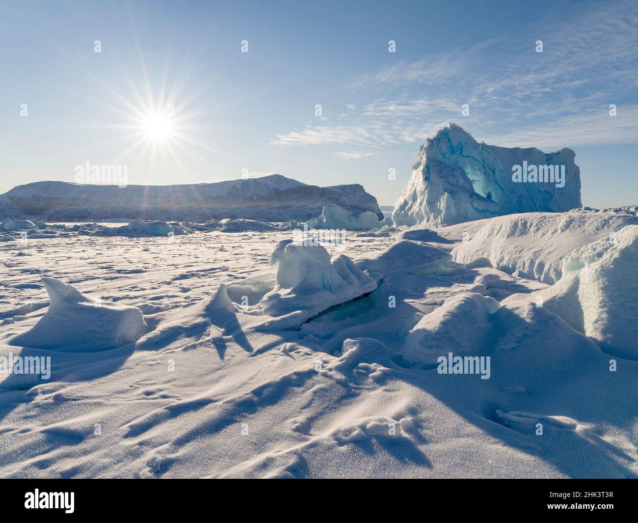 Icebergs frozen into the sea ice of the Uummannaq fjord system during ...