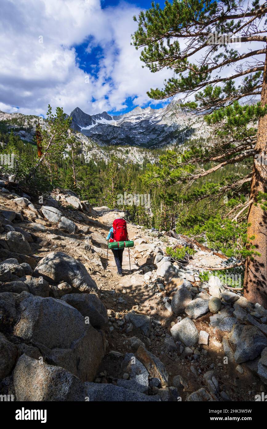 Backpacker on trail in the John Muir Wilderness, Sierra Nevada ...