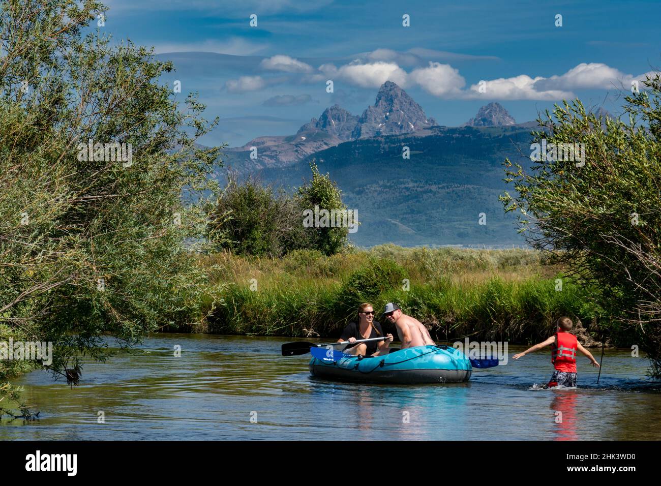 USA, Idaho. Family enjoying Teton River on west side of Teton Mountains ...
