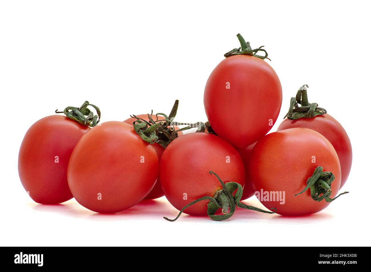 Image of eight red tomatoes with ponytails on a white background Stock ...