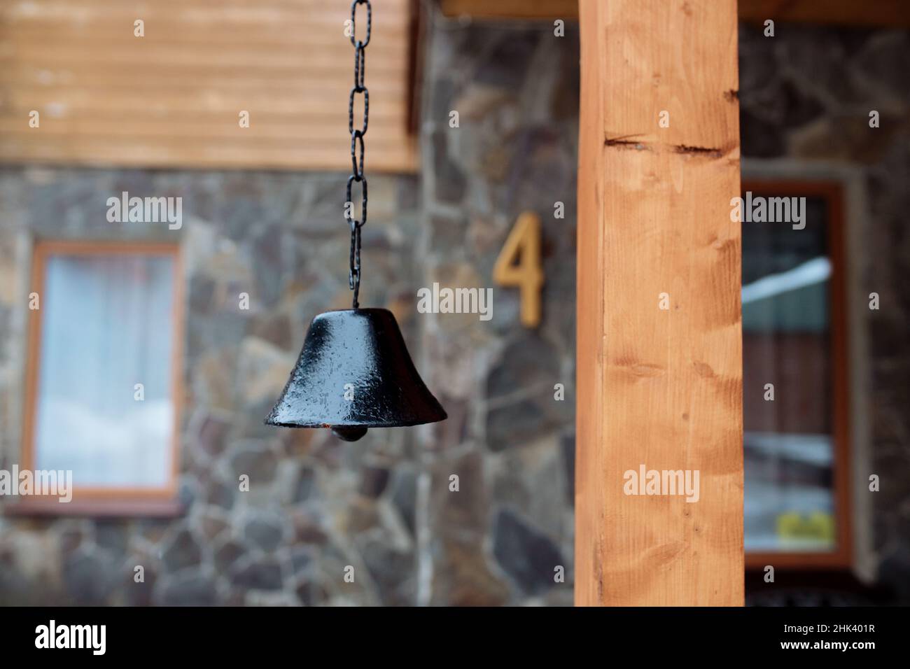 old bell on the facade of the house. The exterior of the building and ...