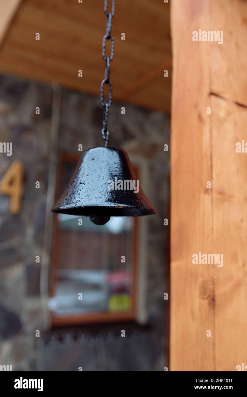 old bell on the facade of the house. The exterior of the building and ...