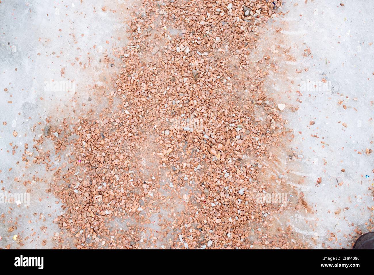 Pedestrian road sprinkled with salt and sand mixtures. De-icing ...