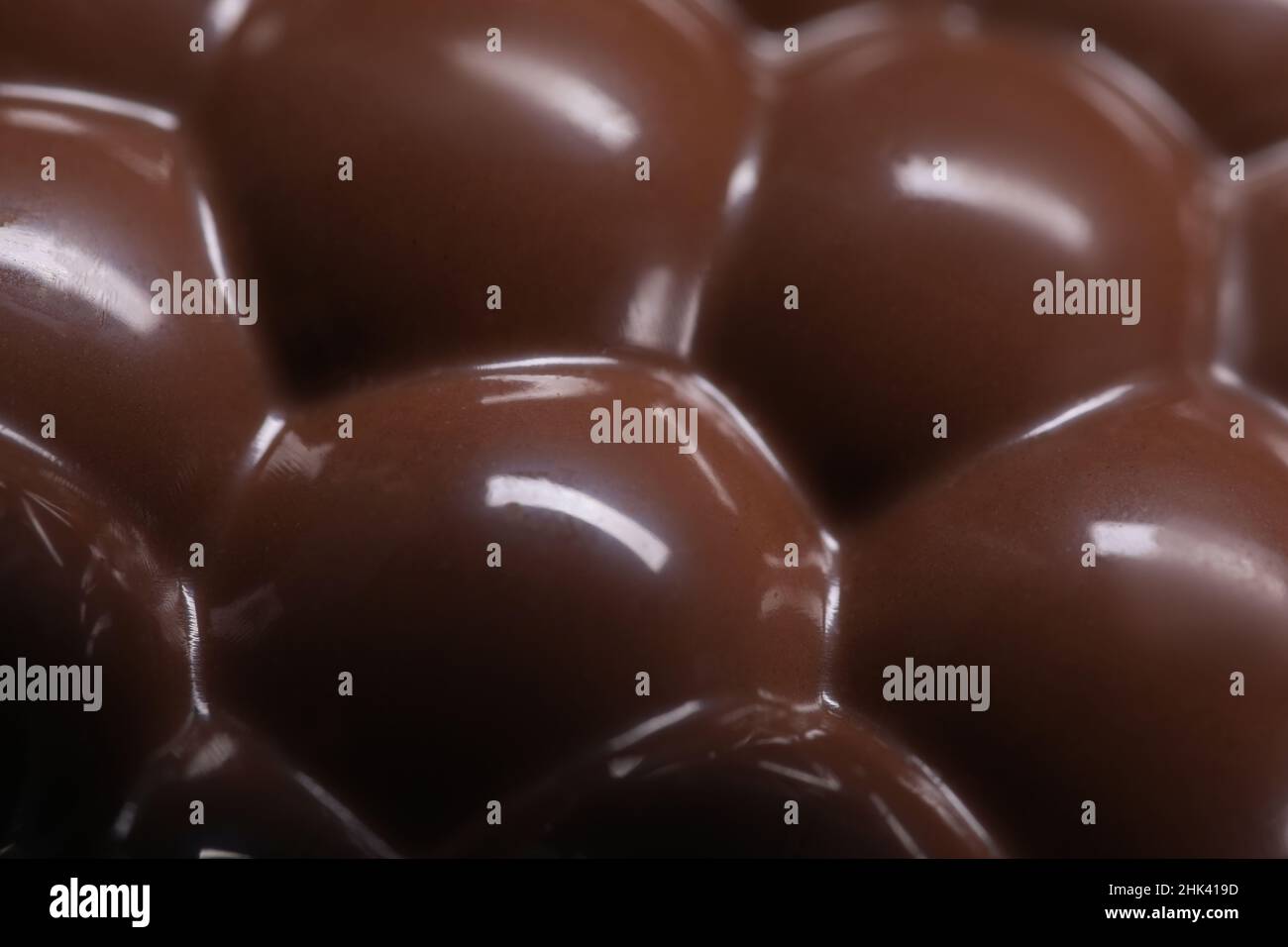 Closeup of bar of airy aerated milk chocolate background Stock Photo ...