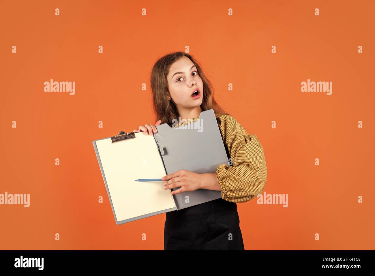 study and work. surprised teen girl with document folder. happy ...