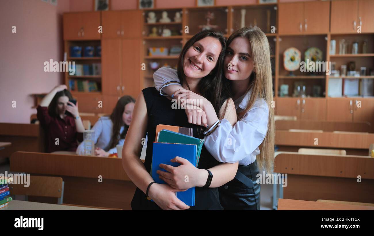 Beautiful female students are posing in the class Stock Photo - Alamy