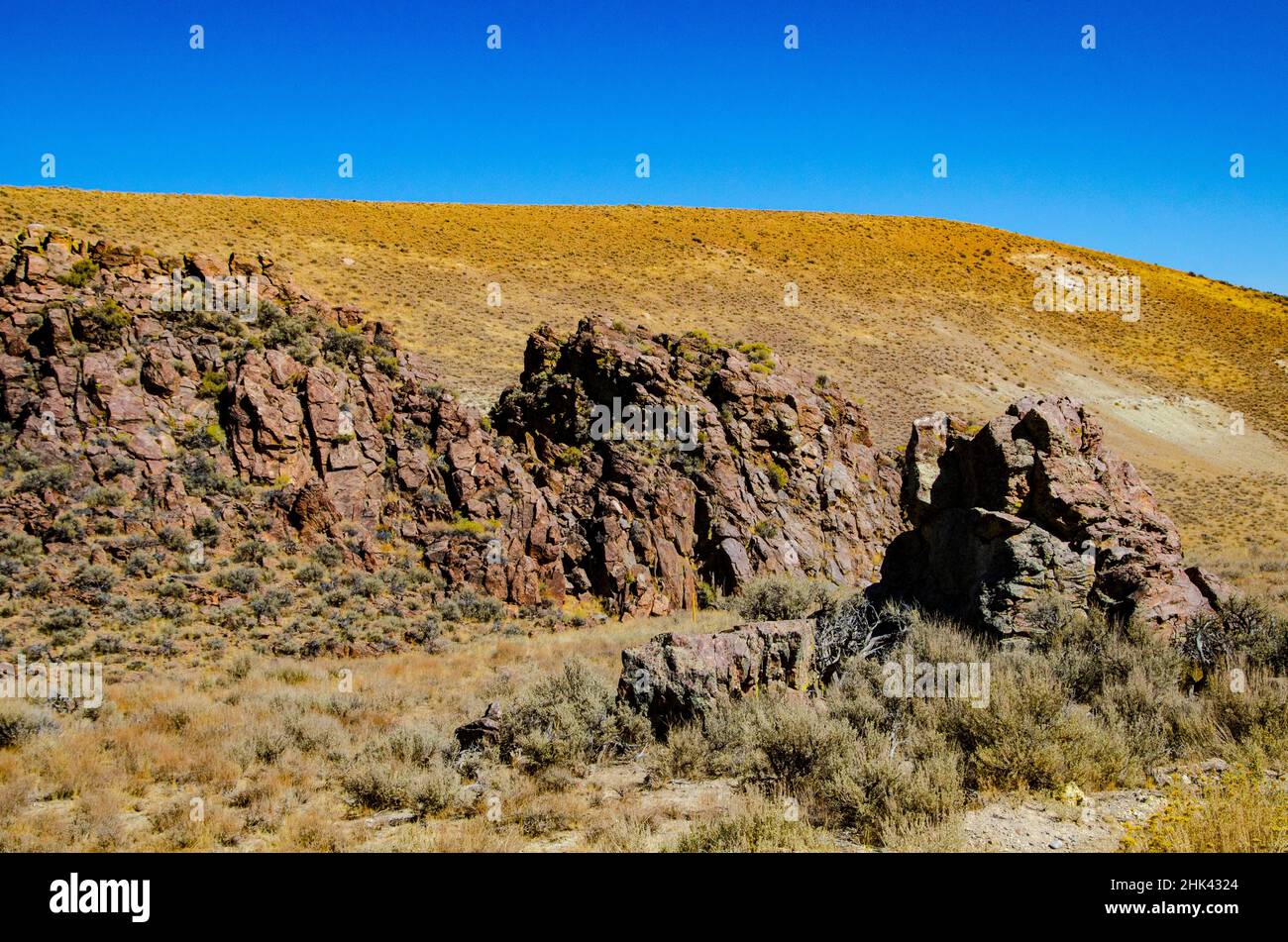 USA, California. Black Rock Desert, volcanic basalt with red-orange ...
