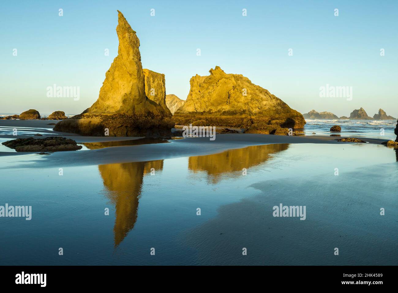 USA, Oregon, Bandon Beach. Wizard's Hat formation at sunset. Credit as ...