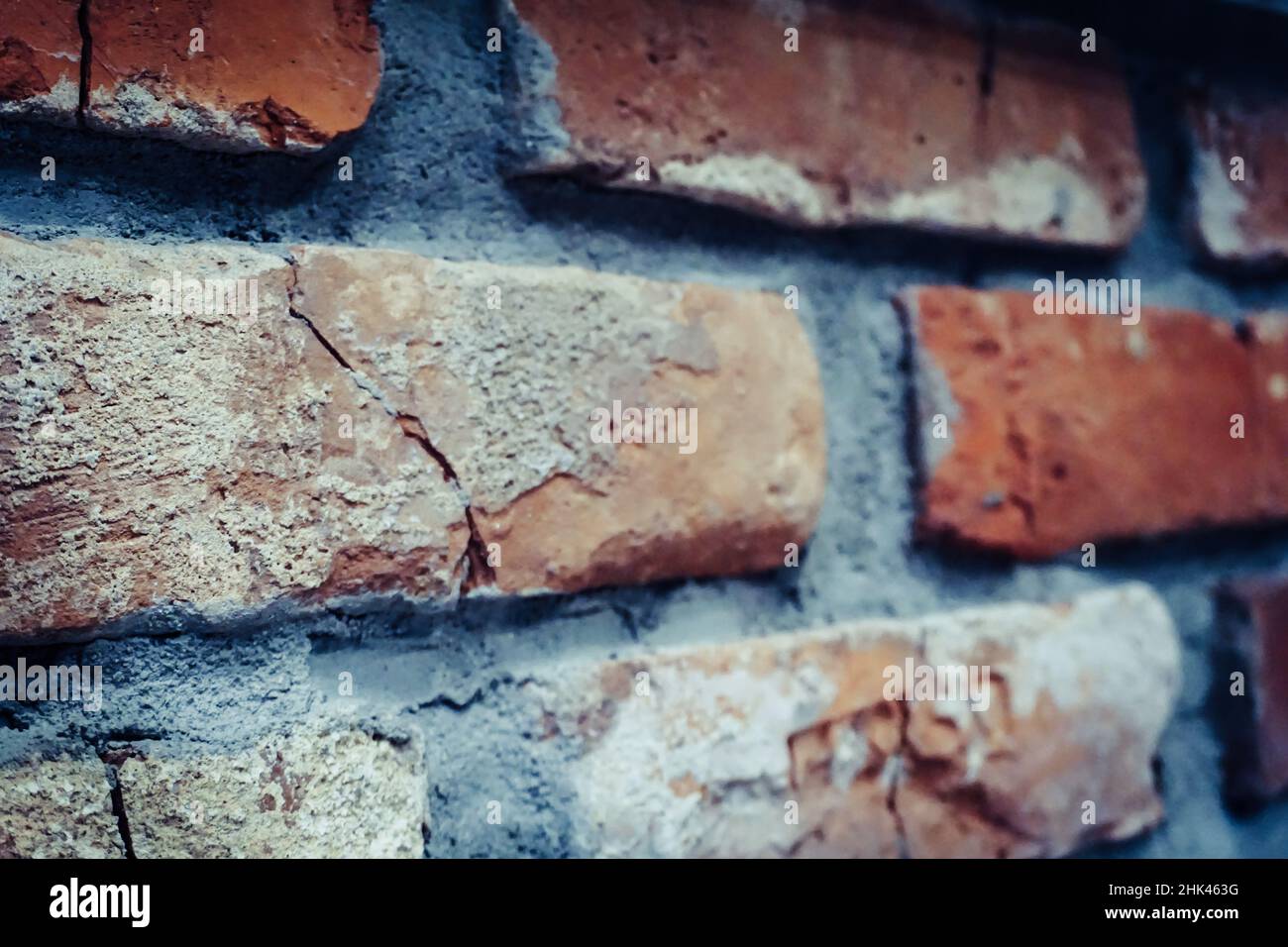 Vintage, cracked bricks with letters on a wall Stock Photo - Alamy