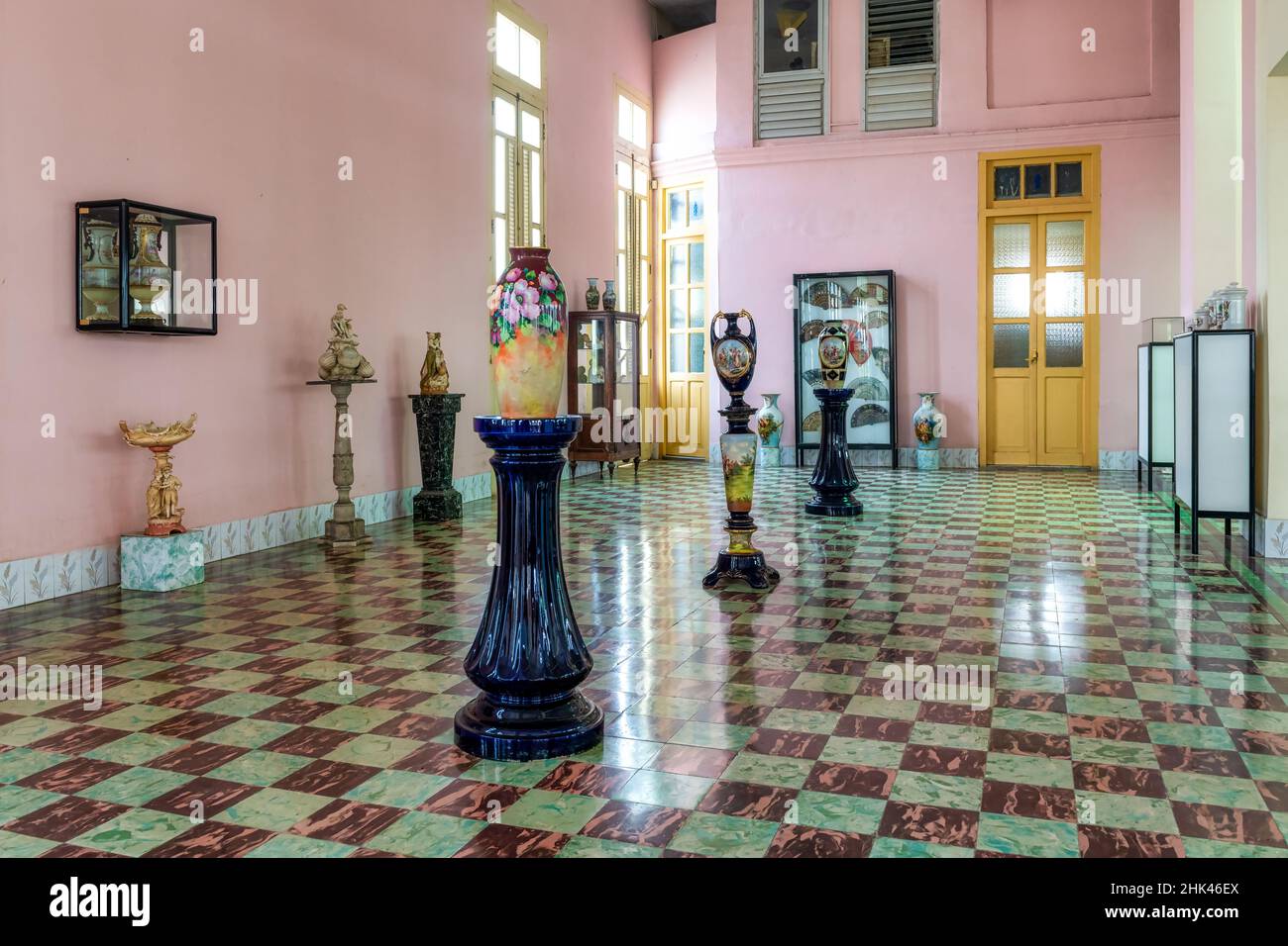 Decorative art vases plus colonial furniture in a living room in the ...