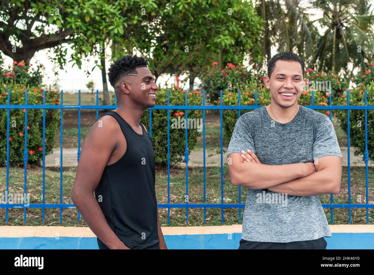 Two friends in sportswear having fun in the street Stock Photo - Alamy