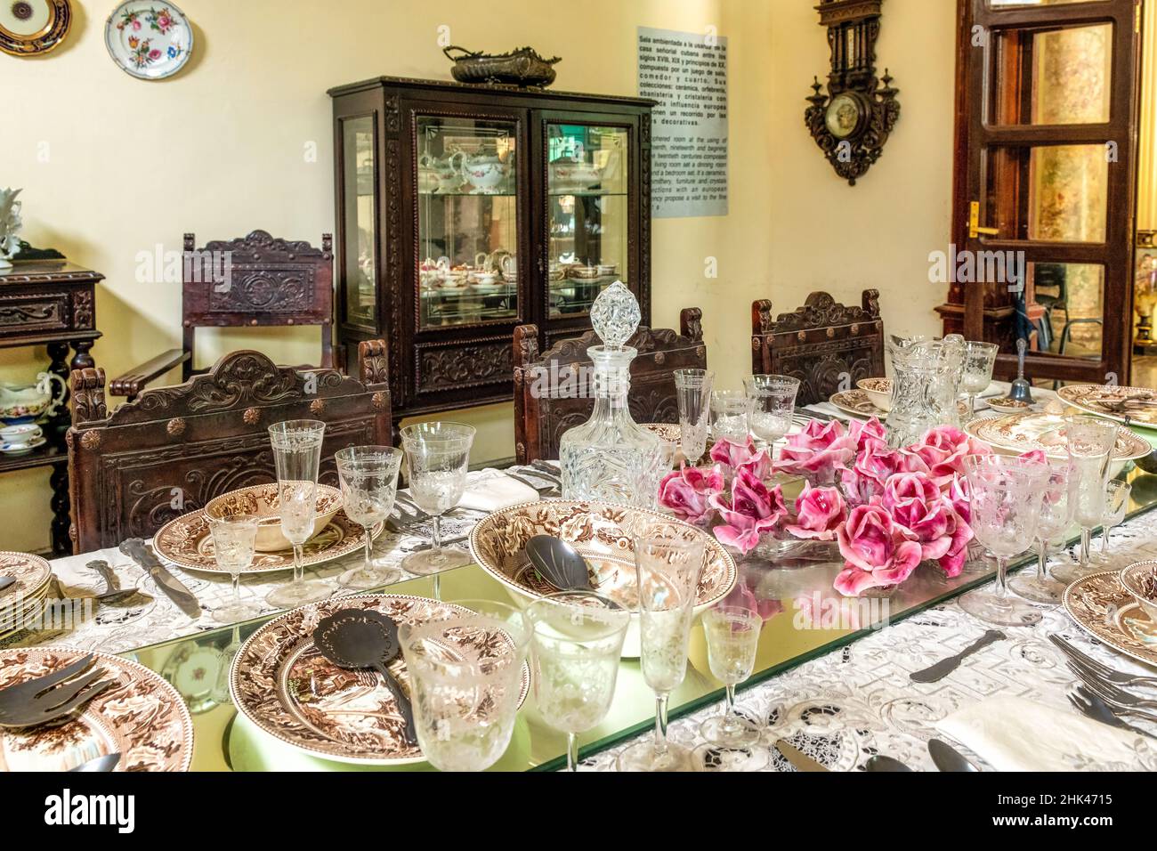 Red flowers centerpiece in a set-up dining room table in the Decorative ...