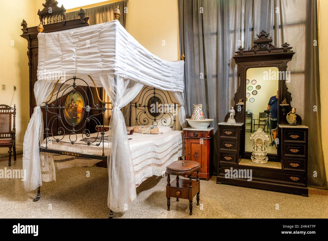 Colonial style bed and other furniture in a bedroom in the Decorative ...