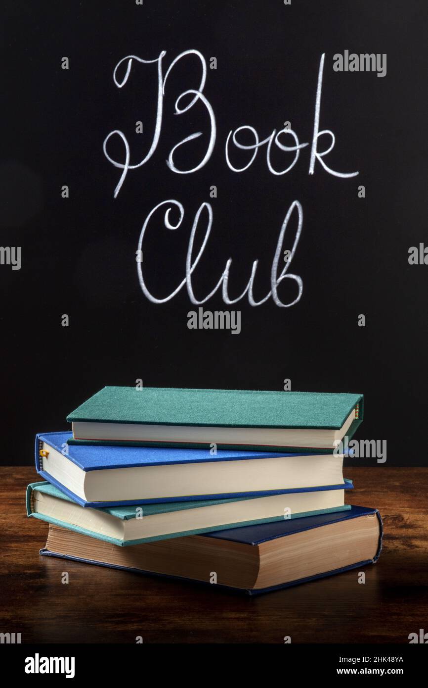 Book Club Concept. A stack of hardcover books with chalk lettering on a ...